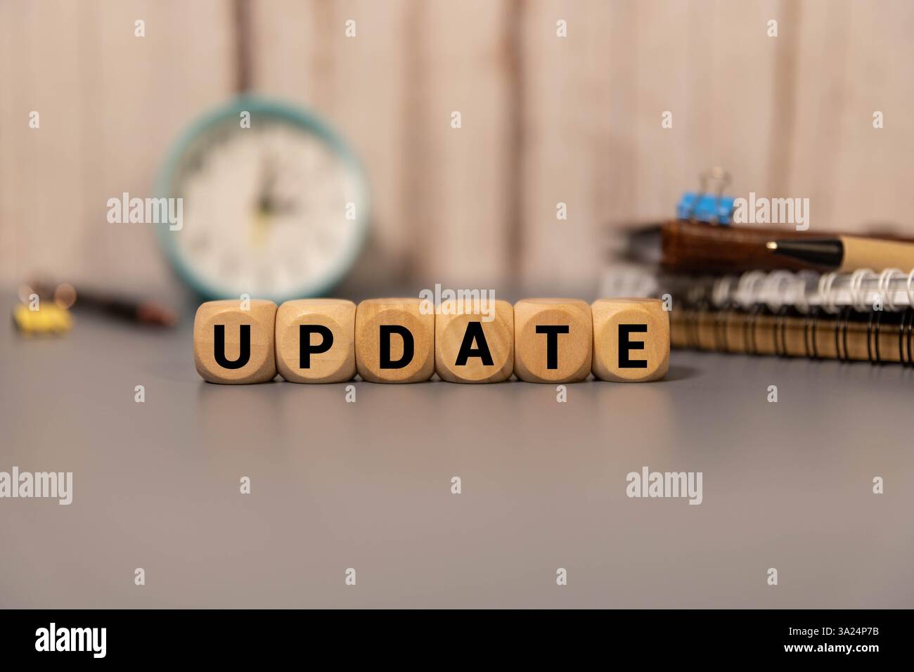 Color block with text UPDATED next to wooden figures Stock Photo - Alamy