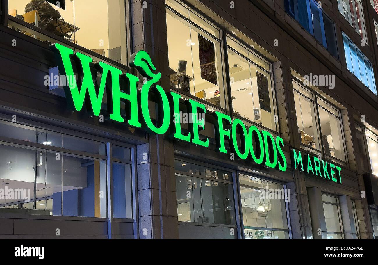 Whole Foods Market, building exterior with store sign at night, New ...