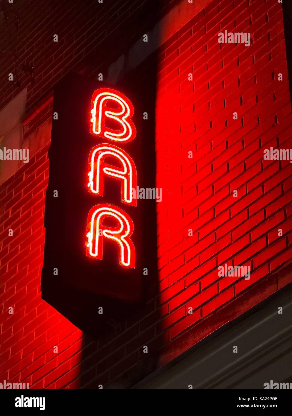 Neon red bar sign on building exterior at night, New York City, New ...