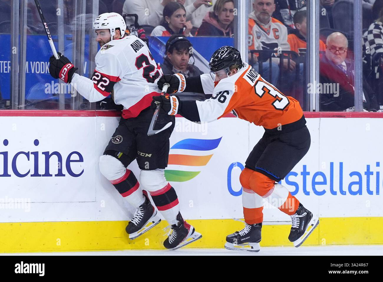 Philadelphia Flyers' Emil Andrae, right, collides with Ottawa Senators ...