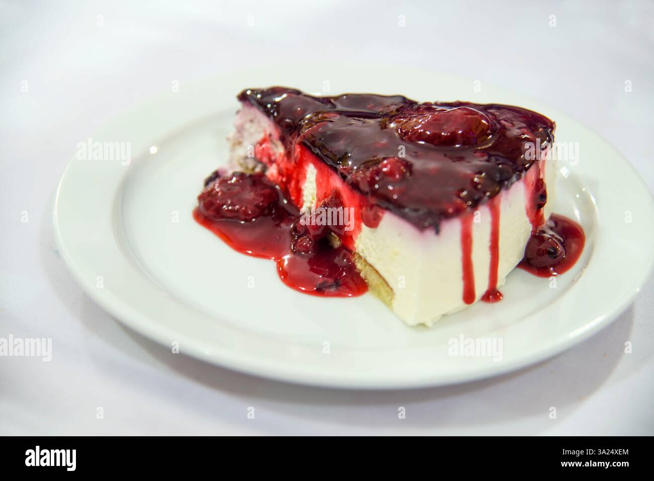 Cheesecake with raspberry sauce Stock Photo - Alamy