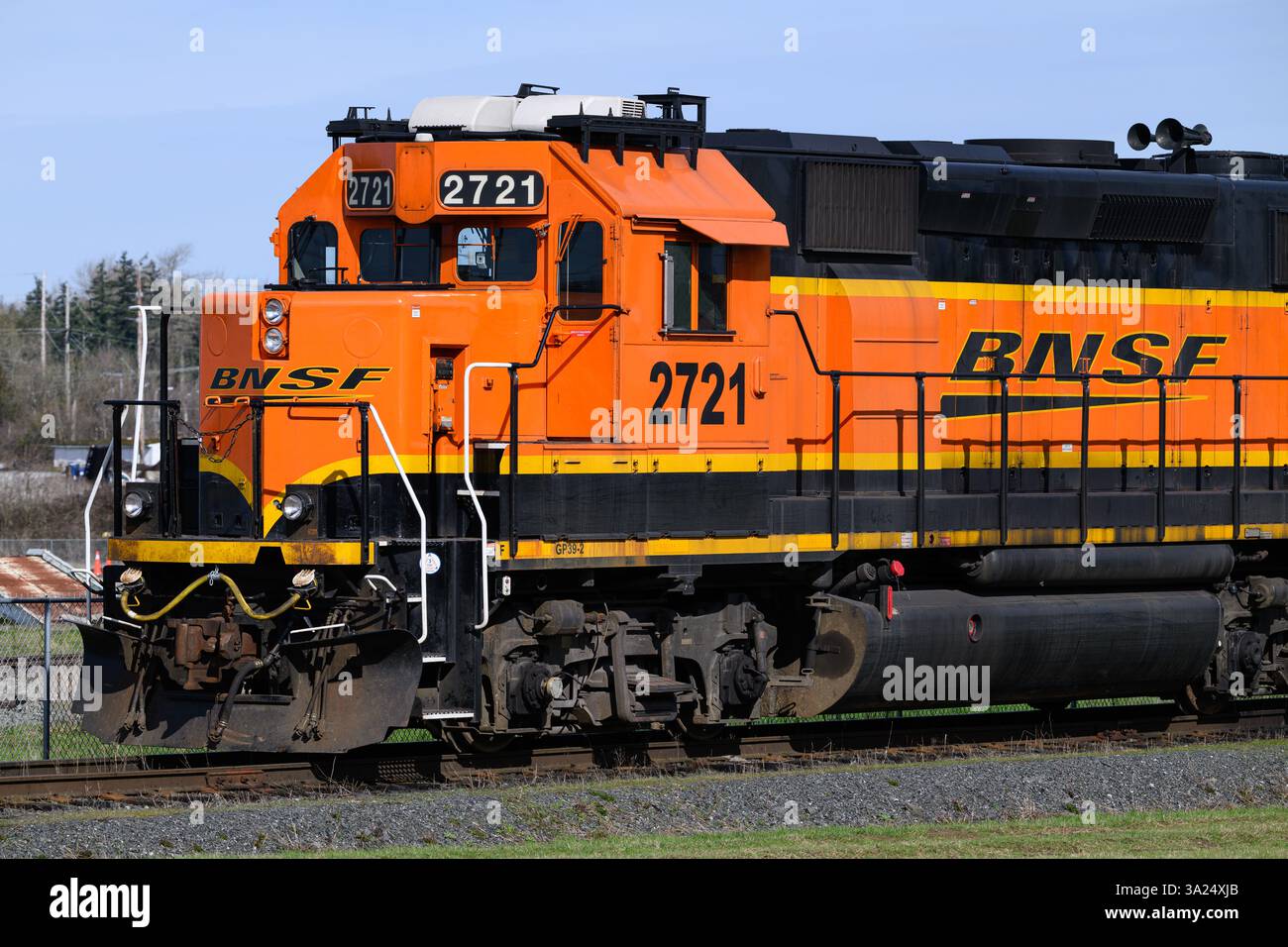 Mount Vernon, WA, USA - February 26, 2025; BNSF GP39-2 diesel locomotive in closeup in orange ...