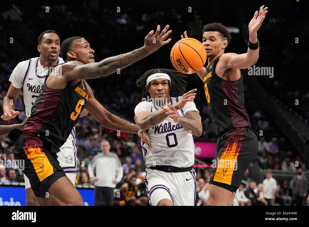 Kansas State's Dug McDaniel (0) passes between Arizona State's Shawn ...