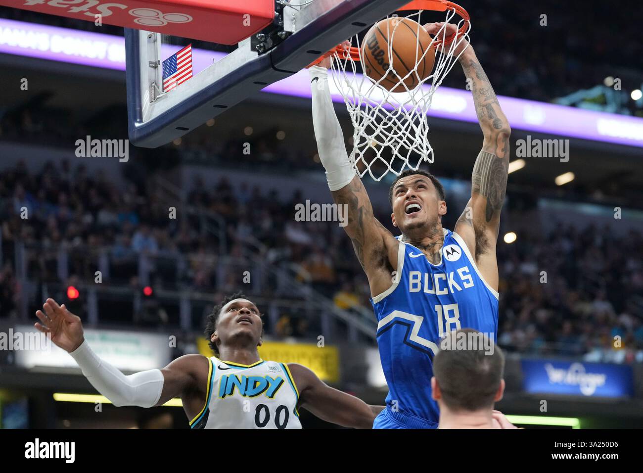 Milwaukee Bucks forward Kyle Kuzma (18) scores in front of Indiana ...