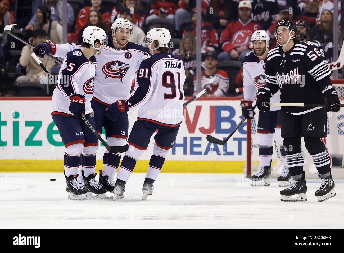 Columbus Blue Jackets right wing Mathieu Olivier is congratulated by ...