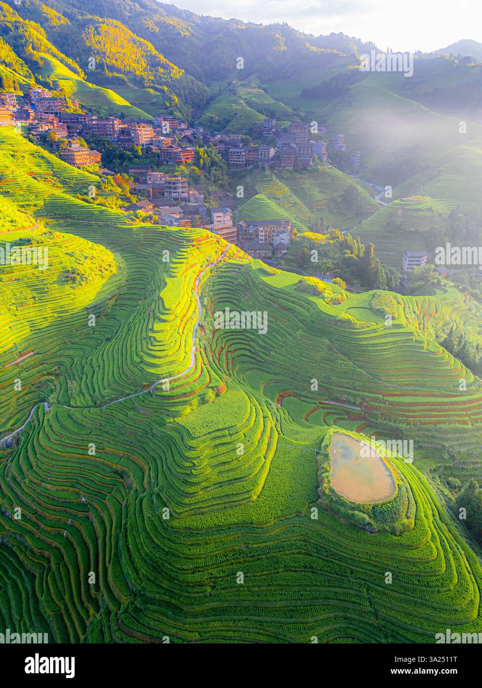 Village with wooden houses at Longji Rice Terraces in China Sunrise ...