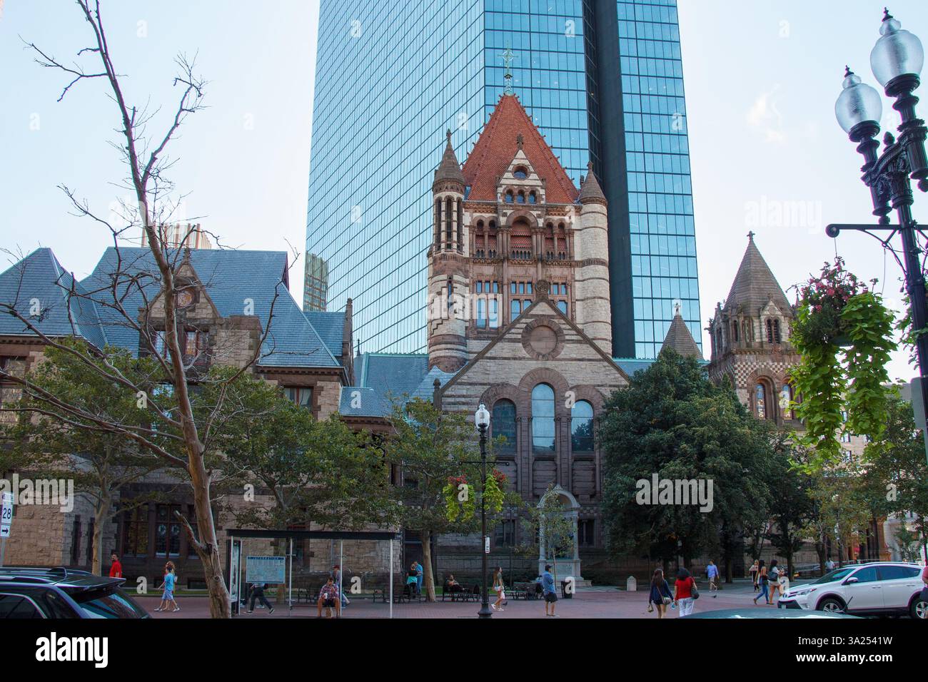 The facade of the Trinity church and a John Hancock tower modern office ...