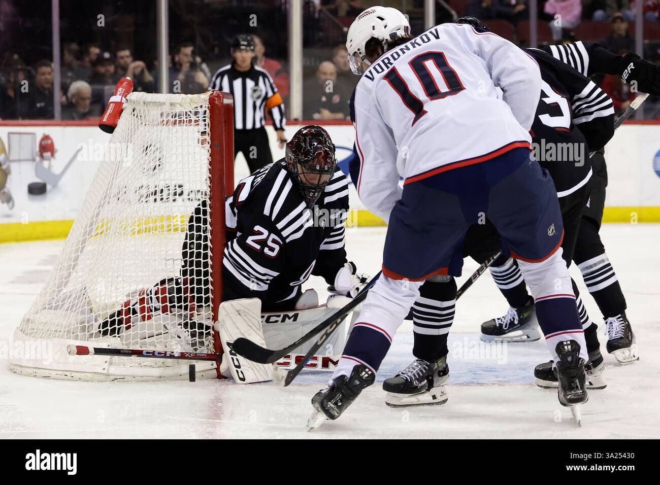 New Jersey Devils goaltender Jacob Markstrom defends his net against ...