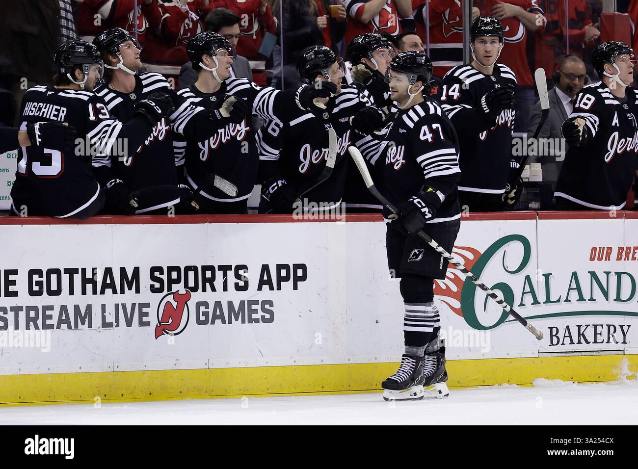 New Jersey Devils center Paul Cotter celebrates with teammates after ...