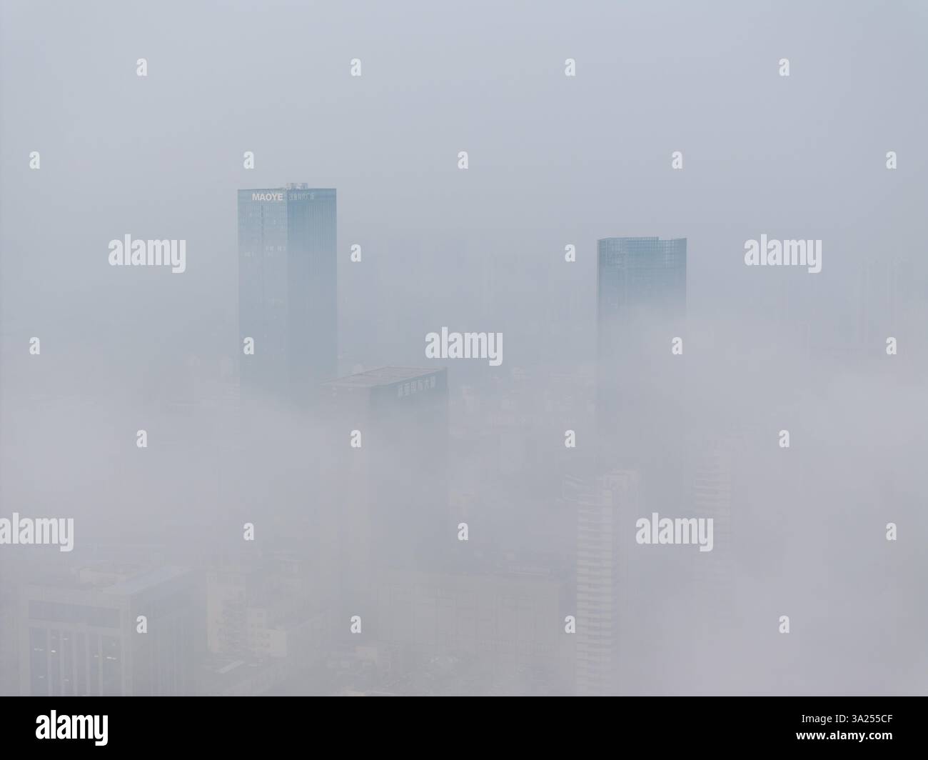 HUAI'AN, CHINA - MARCH 12, 2025 - High-rise buildings loom through ...