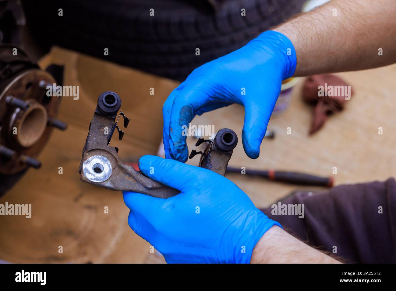 Technical worker assembles, maintains vehicle mechanical component in ...