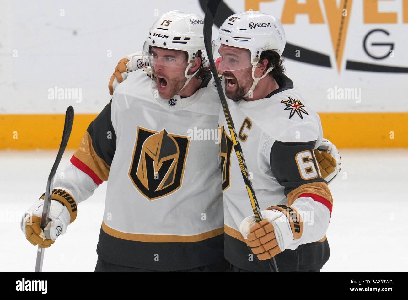 Vegas Golden Knights' Noah Hanifin (15) celebrates with Mark Stone ...
