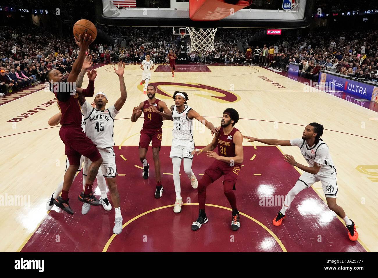 Cleveland Cavaliers guard Darius Garland (10), left, shoots in the ...