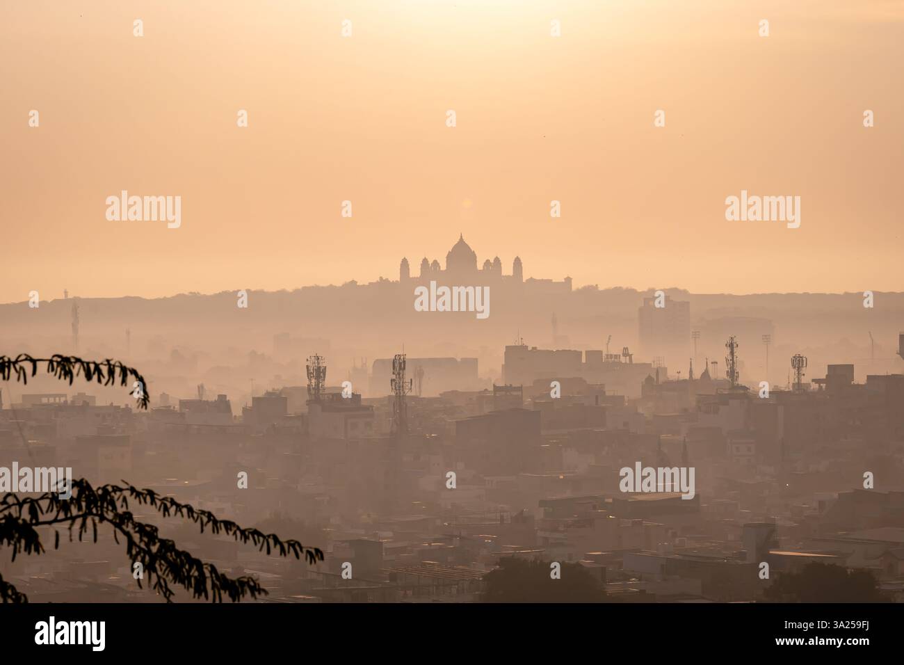 Crowded Cityscape with Palace and Sunrise Mist Stock Photo - Alamy