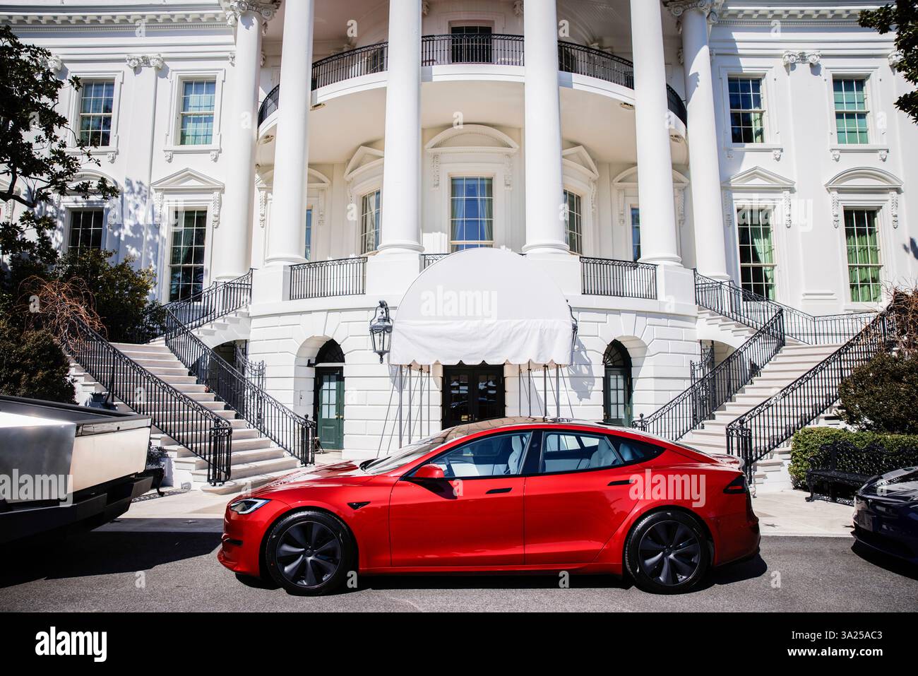 A Tesla Model S is parked with other Tesla vehicles on the South Lawn ...