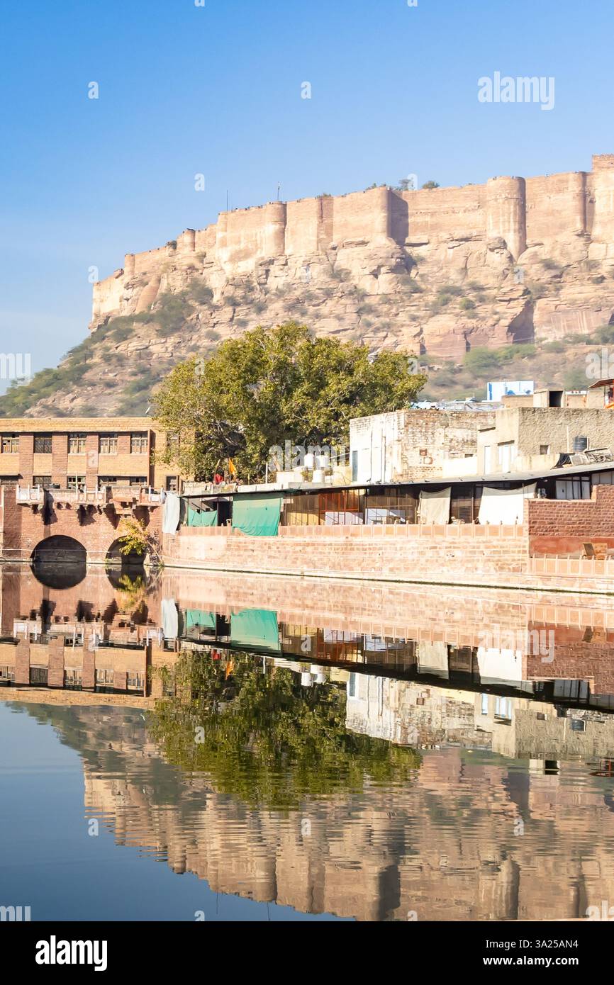 pristine calm lake with water reflection of vintage architecture around ...
