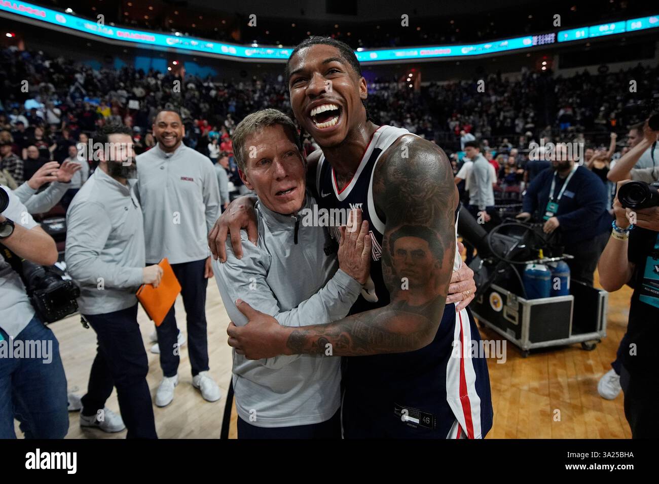 Gonzaga guard Khalif Battle, right, embraces head coach Mark Few after ...
