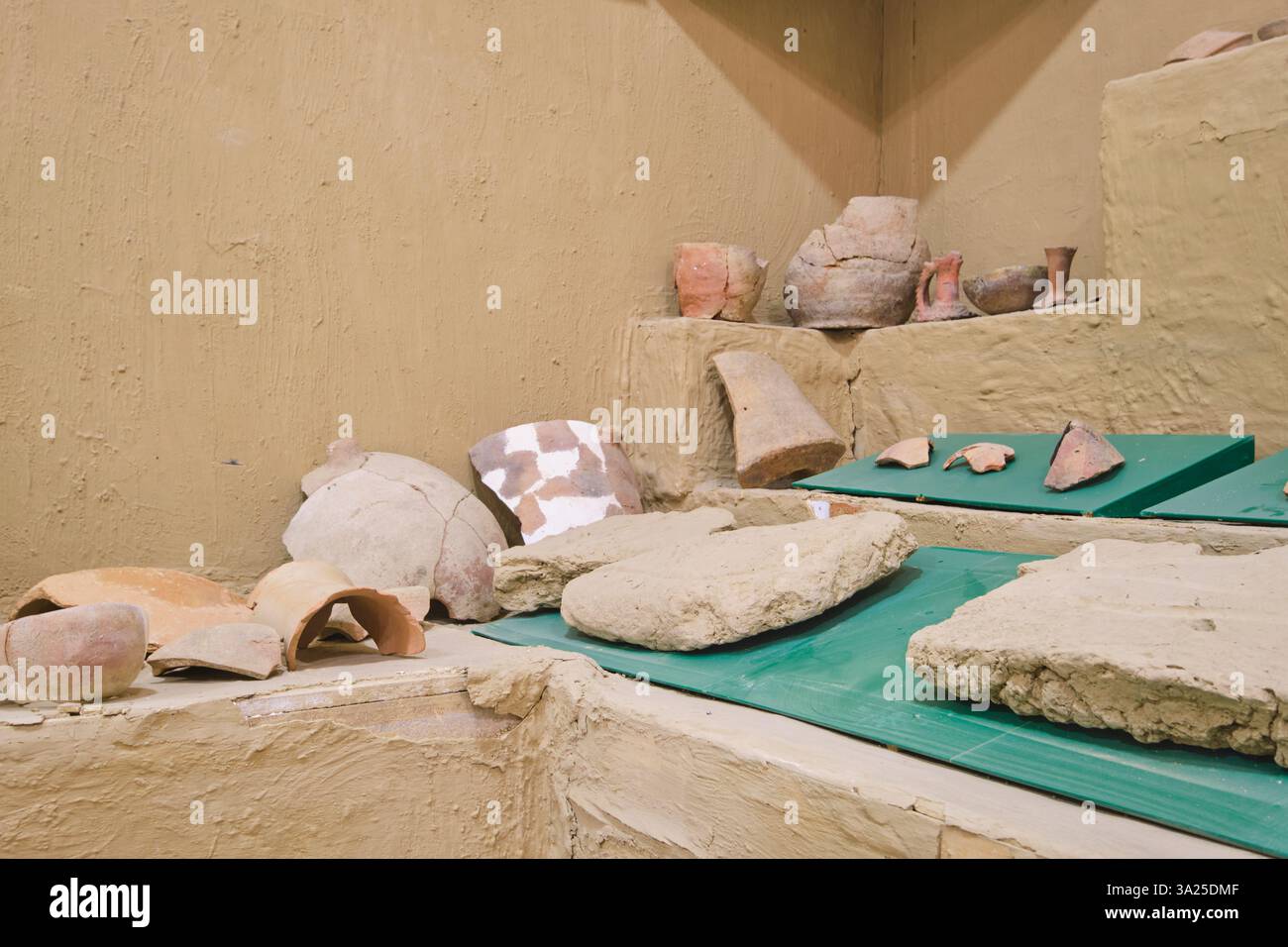 A display of old clay, pottery vases, pieces. At the Afrasiyab Museum ...
