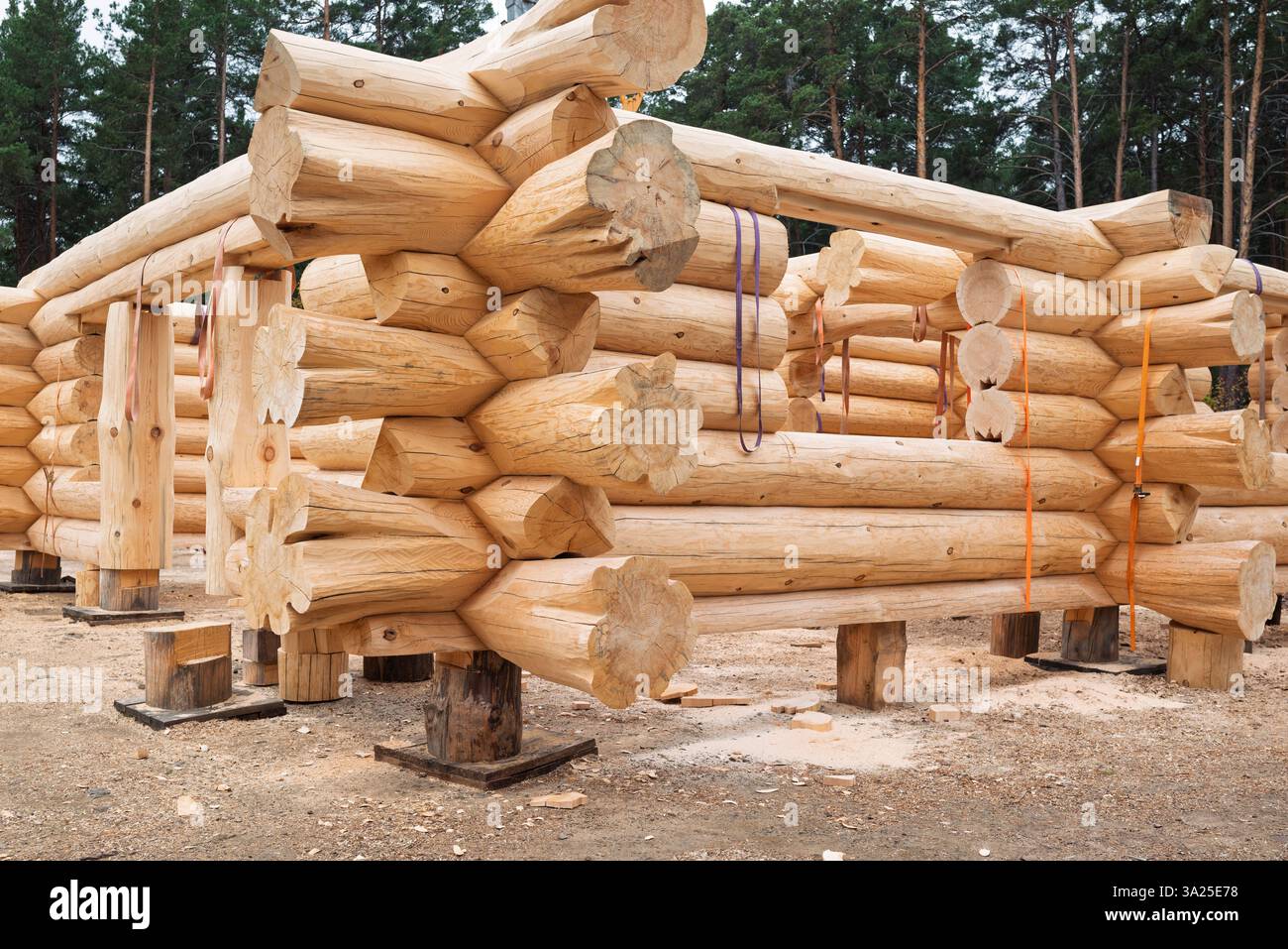 The construction site of a wooden house. Traditional log cabin built ...