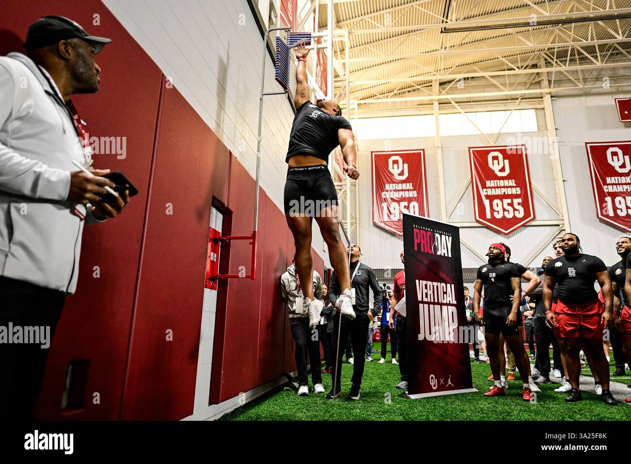 Oklahoma defensive lineman Trace Ford (30) attempts vertical jump ...