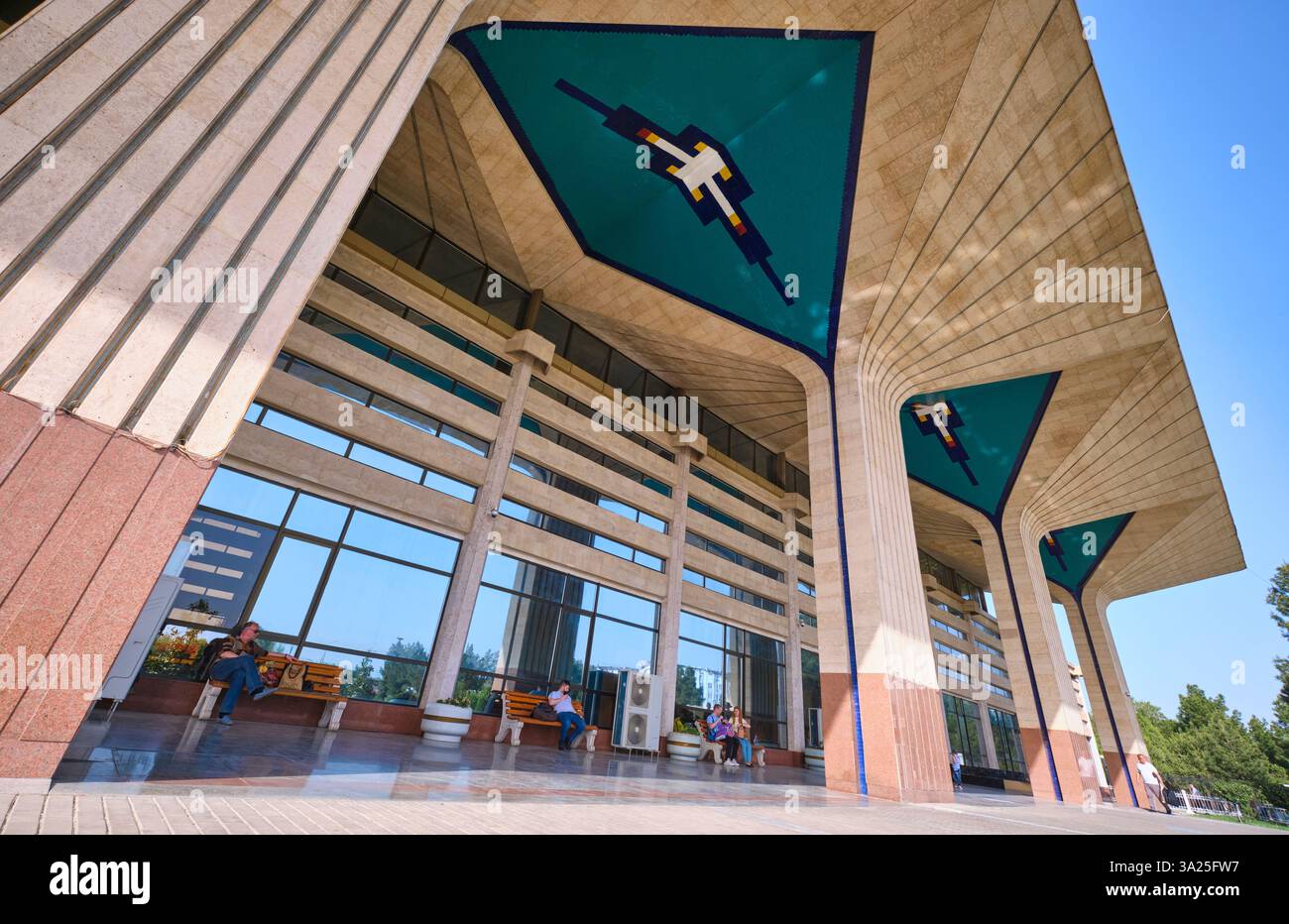 Exterior view of the columns and overhang of the modern building. At ...