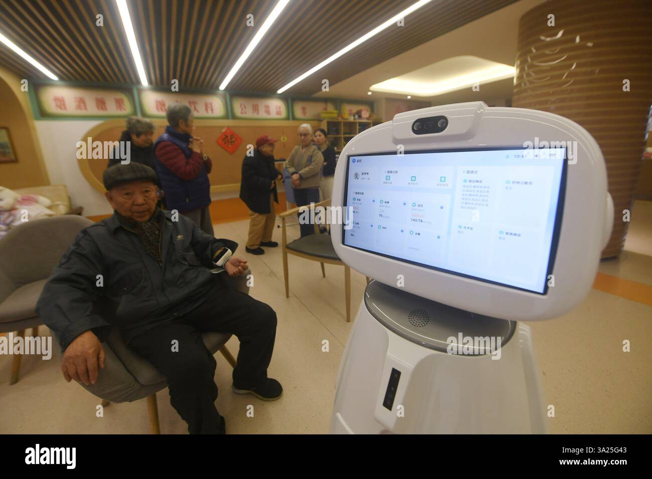 HANGZHOU, CHINA - MARCH 12, 2025 - An AI big-model elderly care robot ...