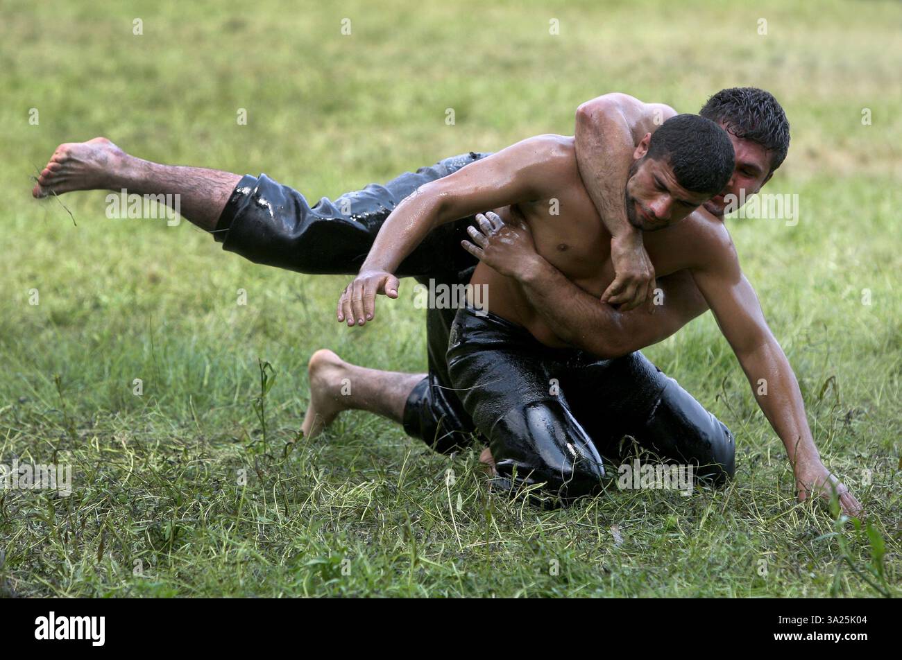 Turkish wrestlers battle for victory at the Kirkpinar Turkish Oil ...