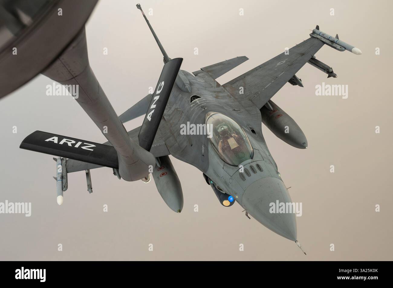 A U.S. Air Force F-16 Fighting Falcon prepares to be refueled over the ...