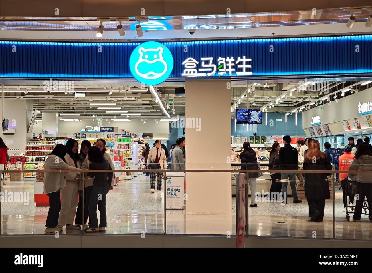 SHANGHAI, CHINA - MARCH 12, 2025 - Customers shop at a Freshippo store ...