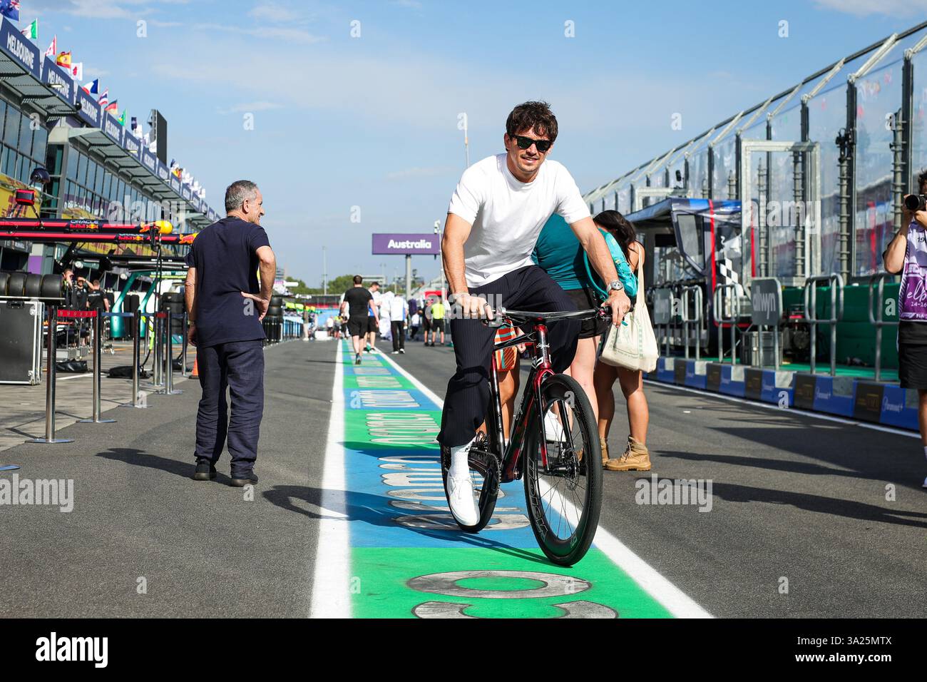 LECLERC Charles (mco), Scuderia Ferrari SF-25, riding his bicycle ...