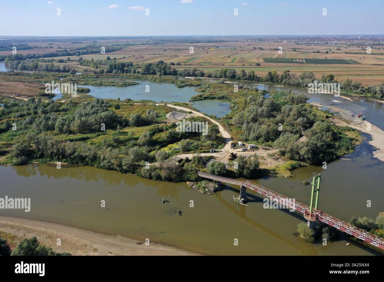 Aerial view of gravel pit mining reservoir and river, ballast ...