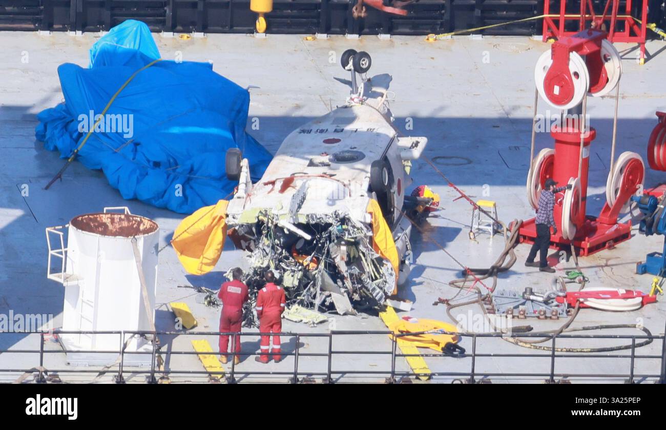 An aerial photo shows a Maritime Self-Defense Force helicopter salvaged ...