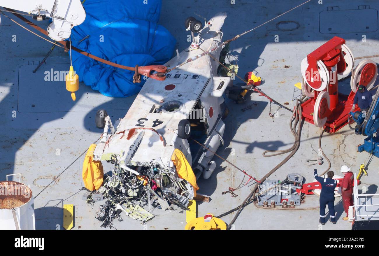 An aerial photo shows a Maritime Self-Defense Force helicopter salvaged ...