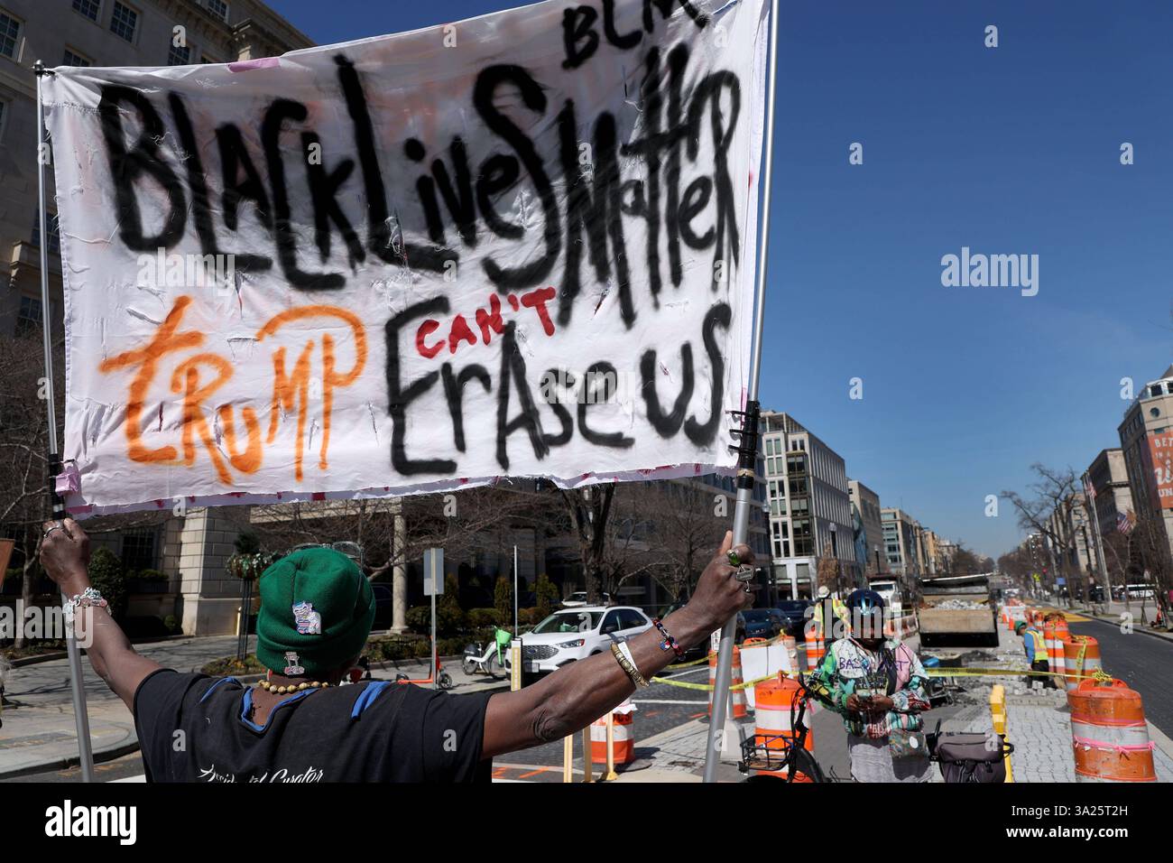 Crews work to remove the Black Lives Matter street mural in Washington ...