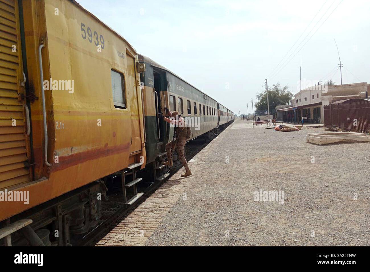 A paramilitary soldier takes position at a railway station near the ...
