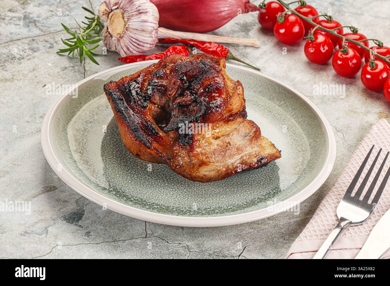 Roasted pork knuckle steak with bone Stock Photo - Alamy