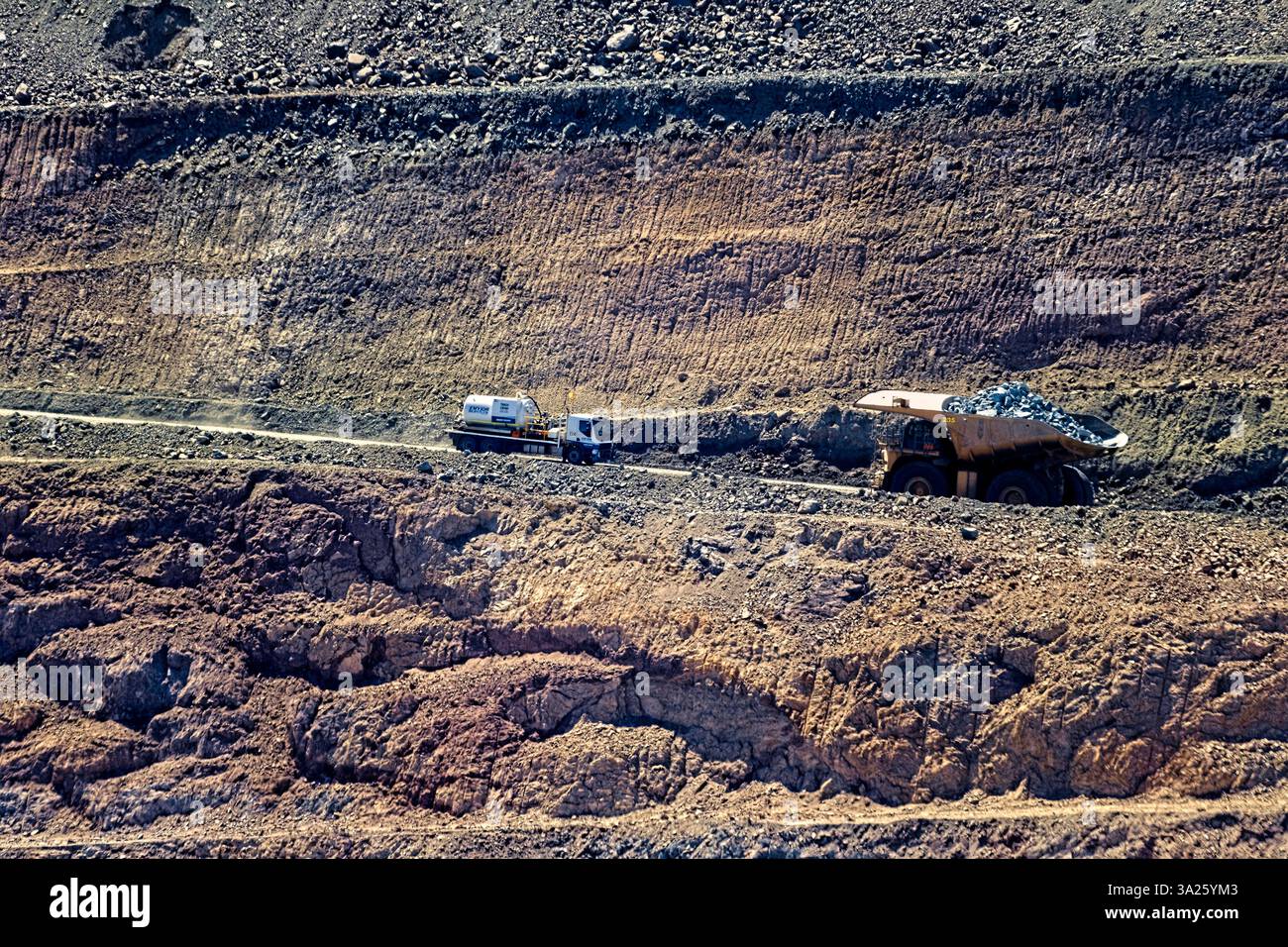 Hall truck and service truck working the super pit gold mine ...