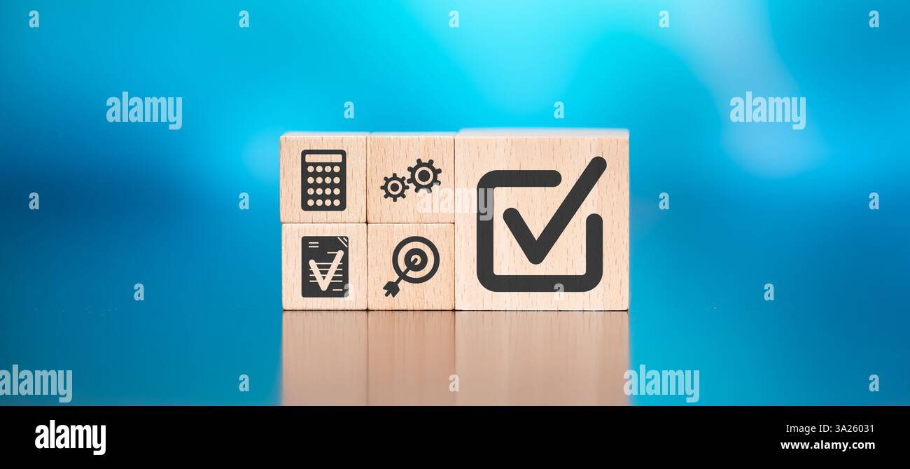 Wooden blocks with symbol of validation concept on blue background ...