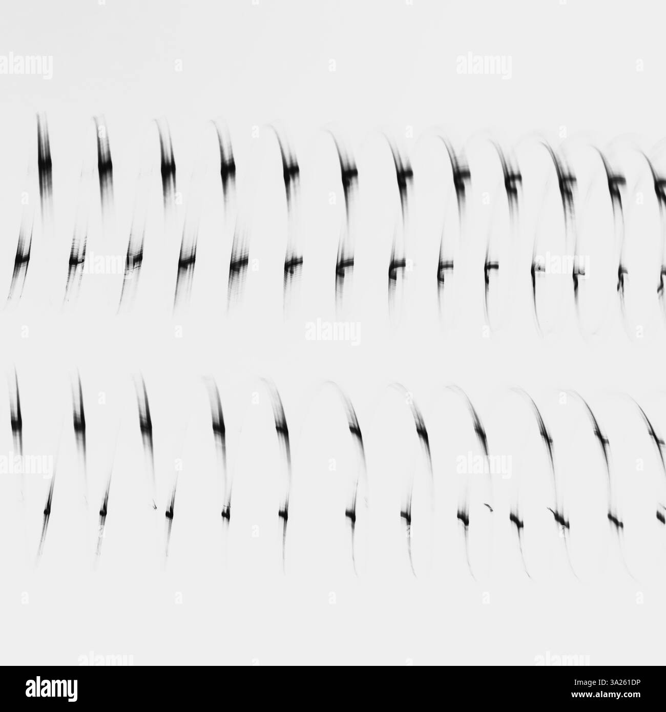 Abstract patternof a length of fine wire wound around and stretched ...