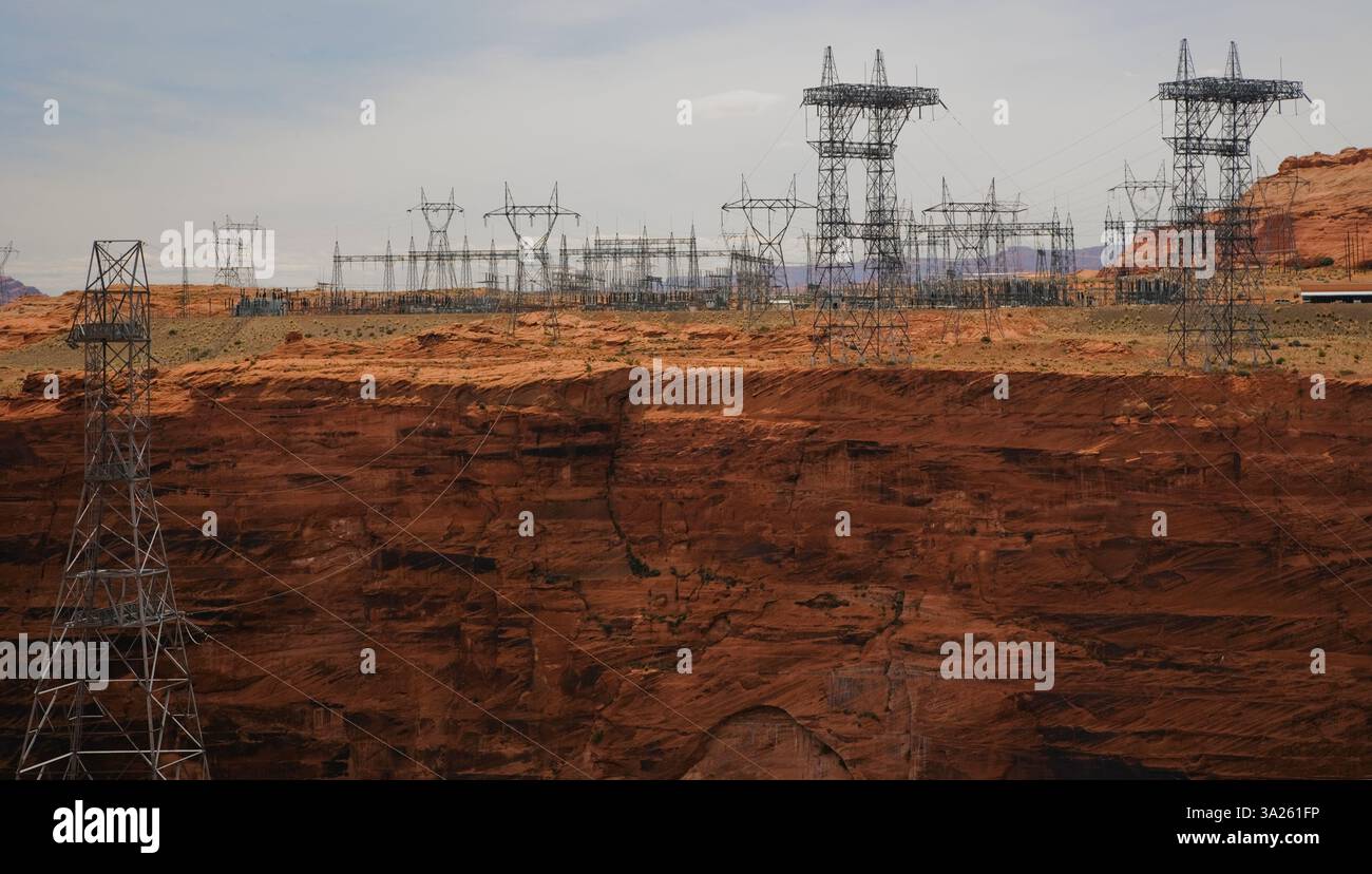 Large power lines on pylons crossing a canyon in Arizona, reaching into ...