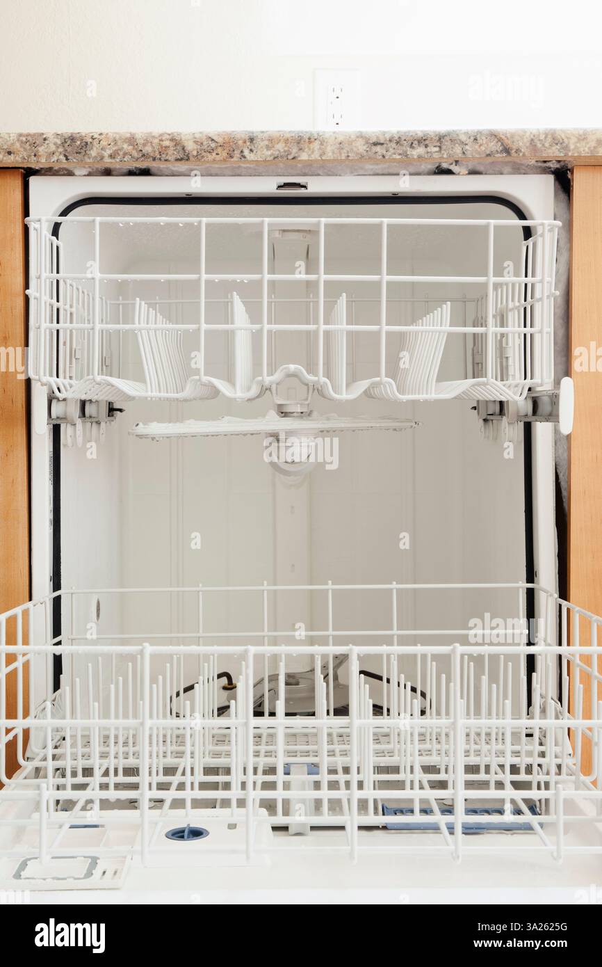 An open dishwasher in a kitchen Stock Photo - Alamy