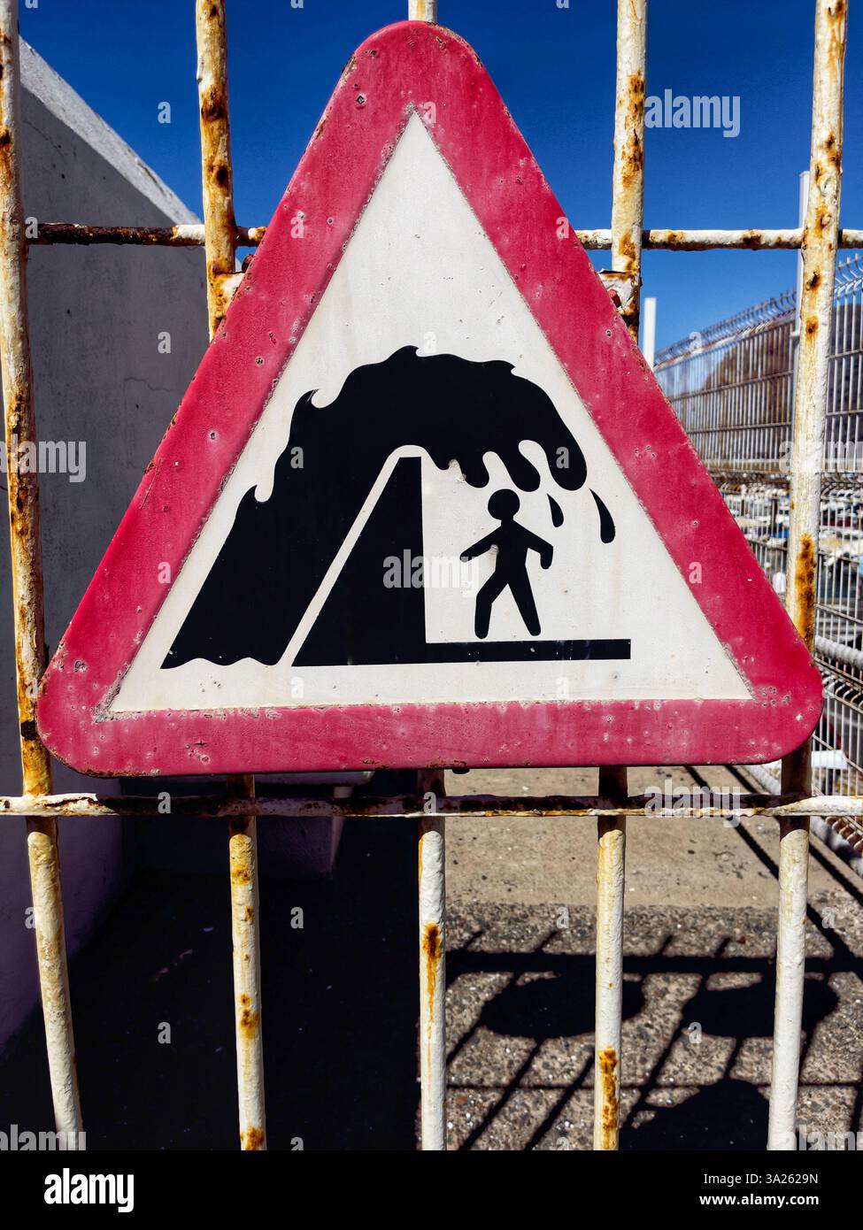 Triangular warning sign with a red border and a black icon of a person ...