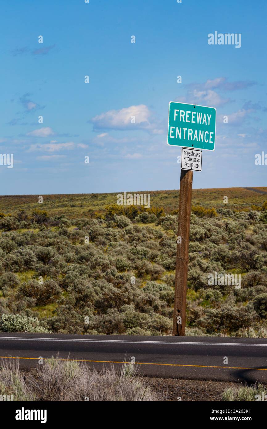 Freeway Entrance signs along the roadside in the rolling landscape of ...