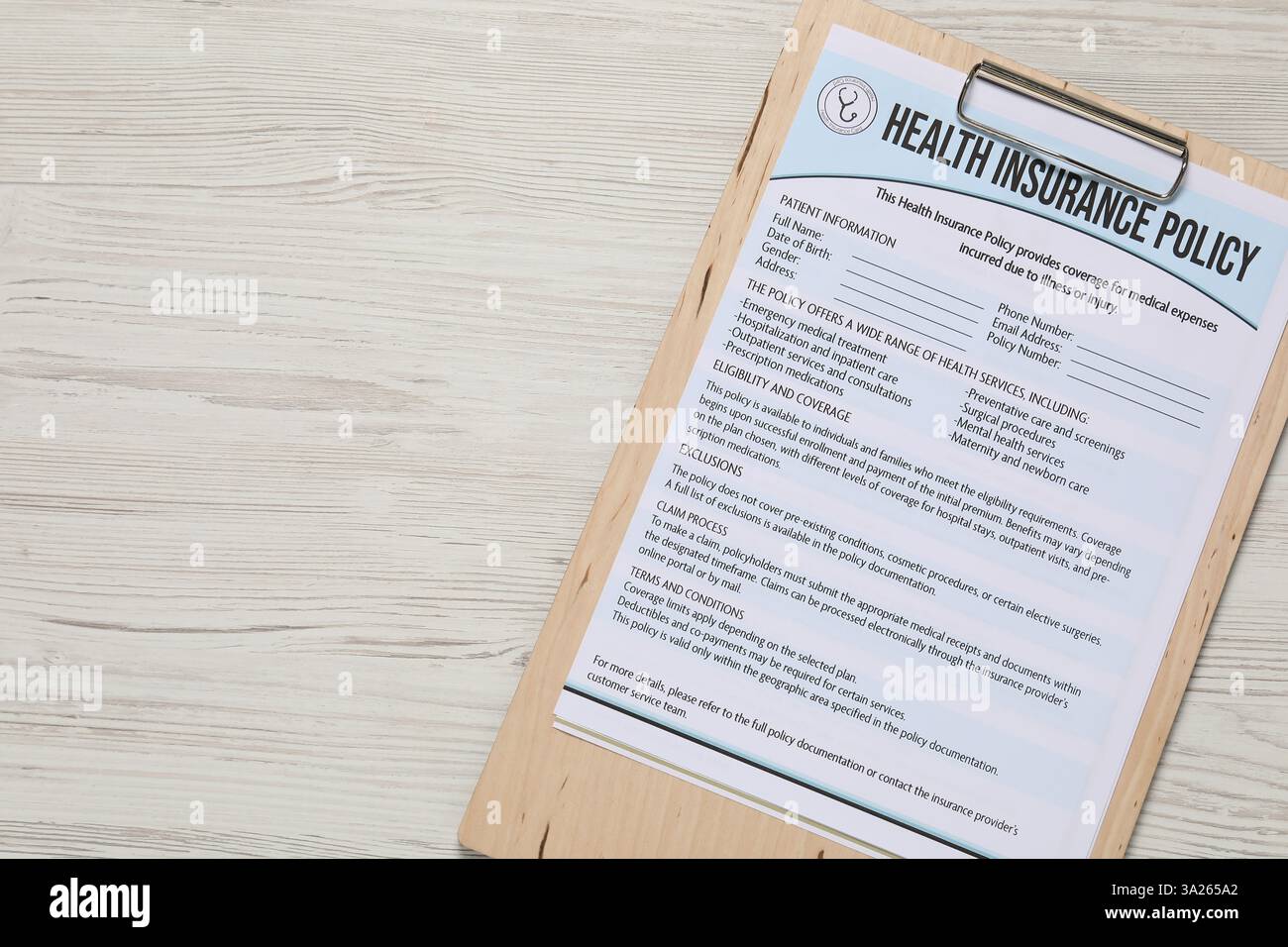 Health insurance policy form on light wooden table, top view. Space for ...