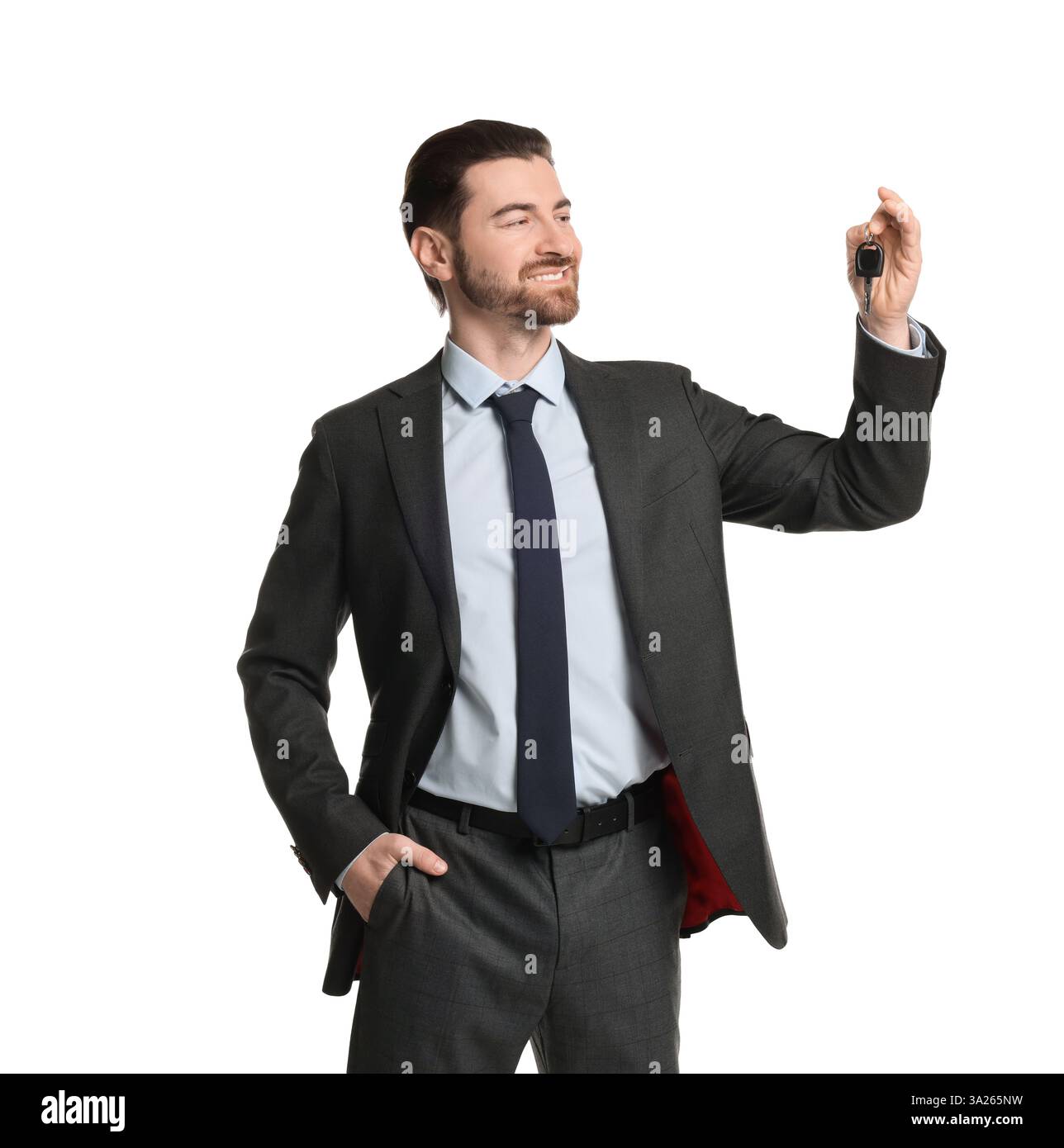 Cheerful salesman with car key on white background Stock Photo - Alamy