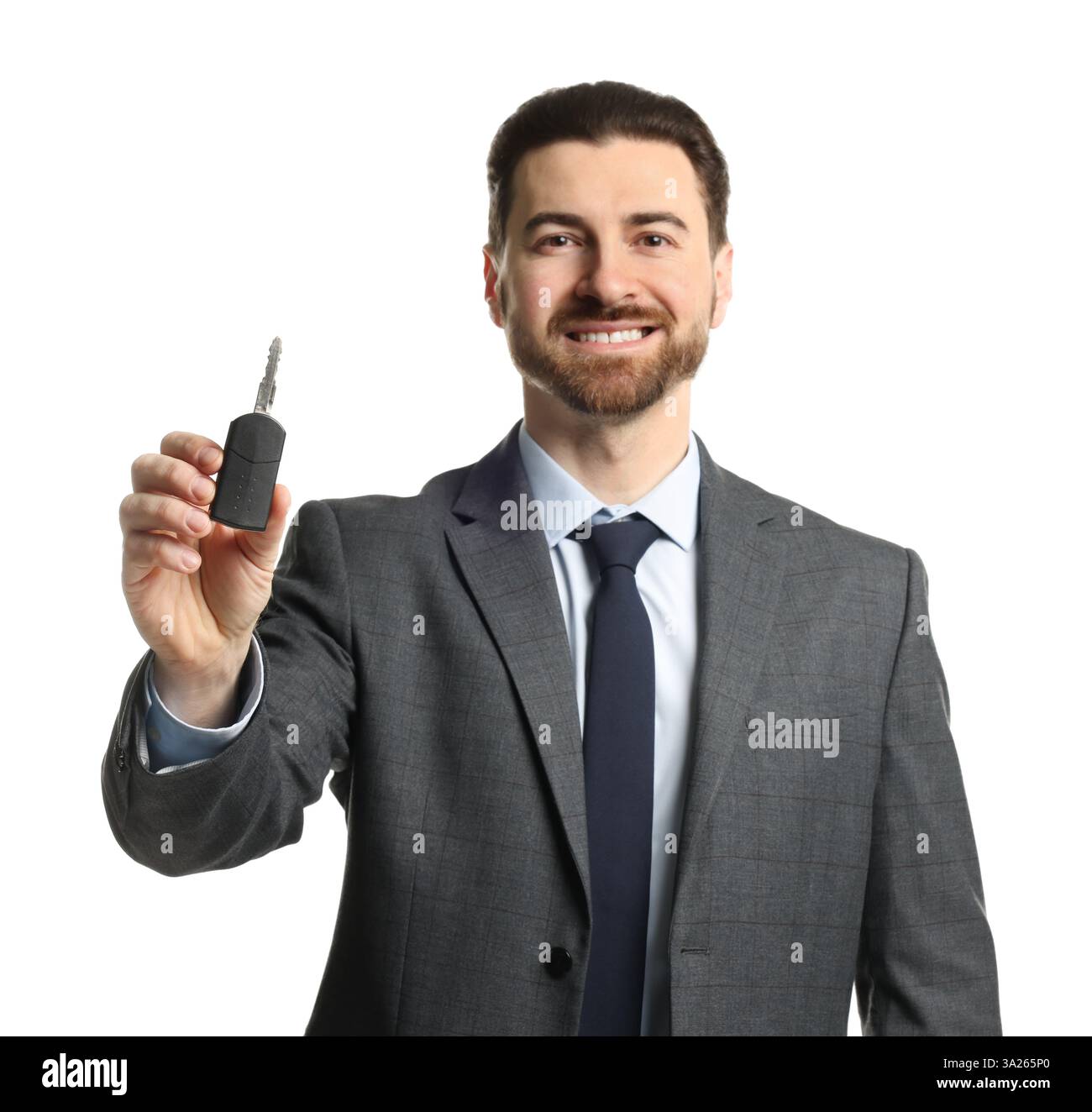 Cheerful salesman with car key on white background Stock Photo - Alamy
