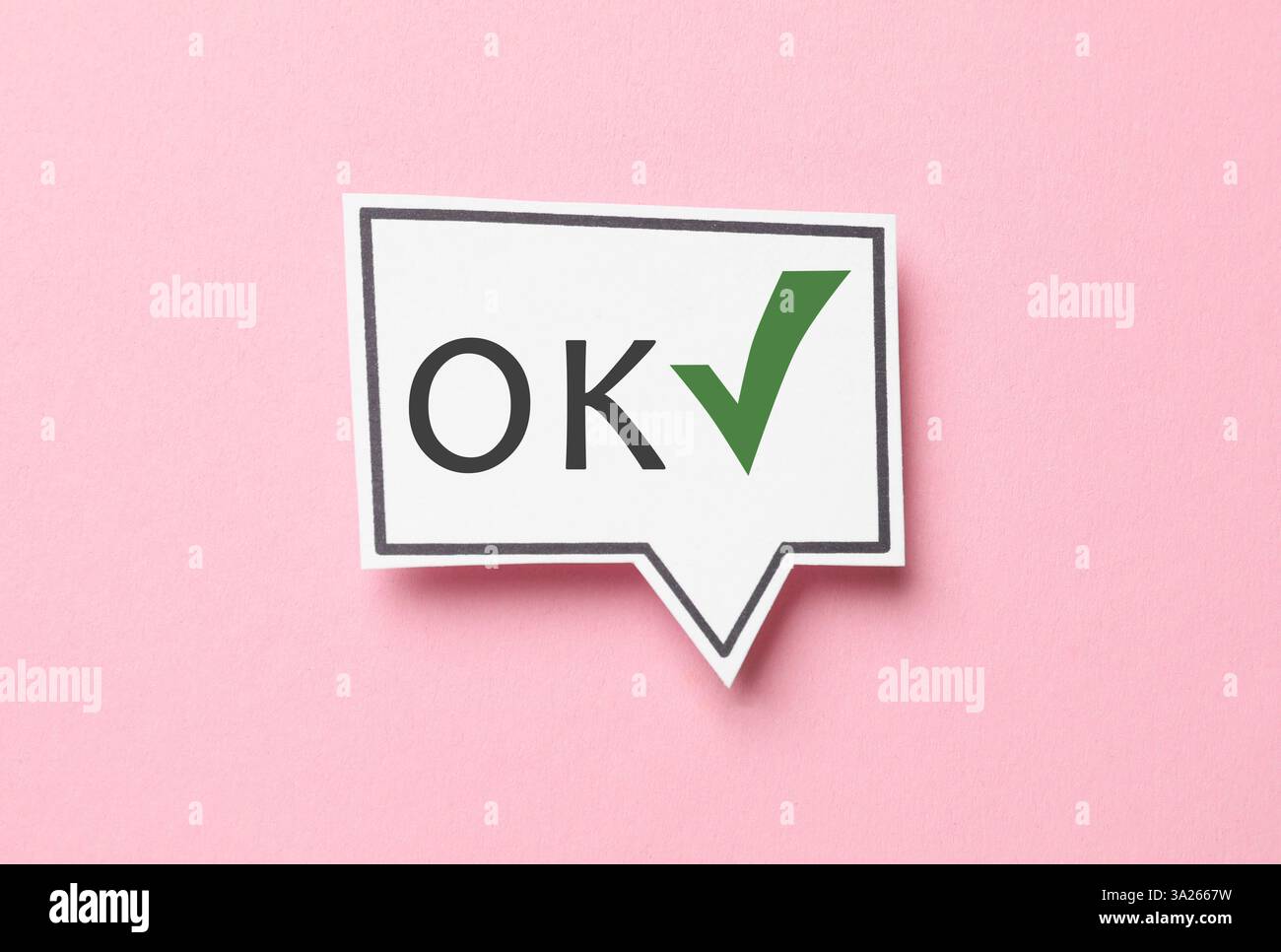 Speech bubble with abbreviation OK and check mark on pink background ...