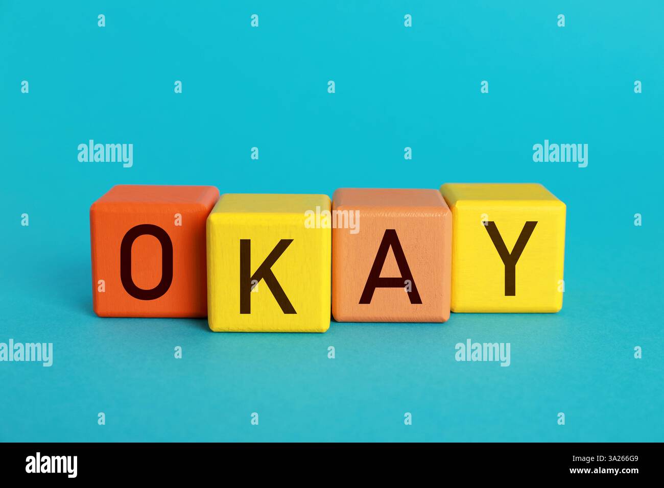 Colorful cubes with word Okay on light blue background Stock Photo - Alamy