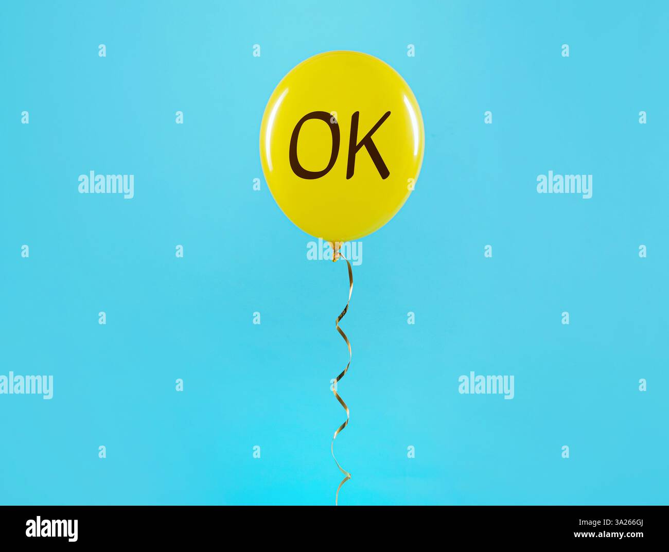 Yellow balloon with abbreviation OK on light blue background Stock ...