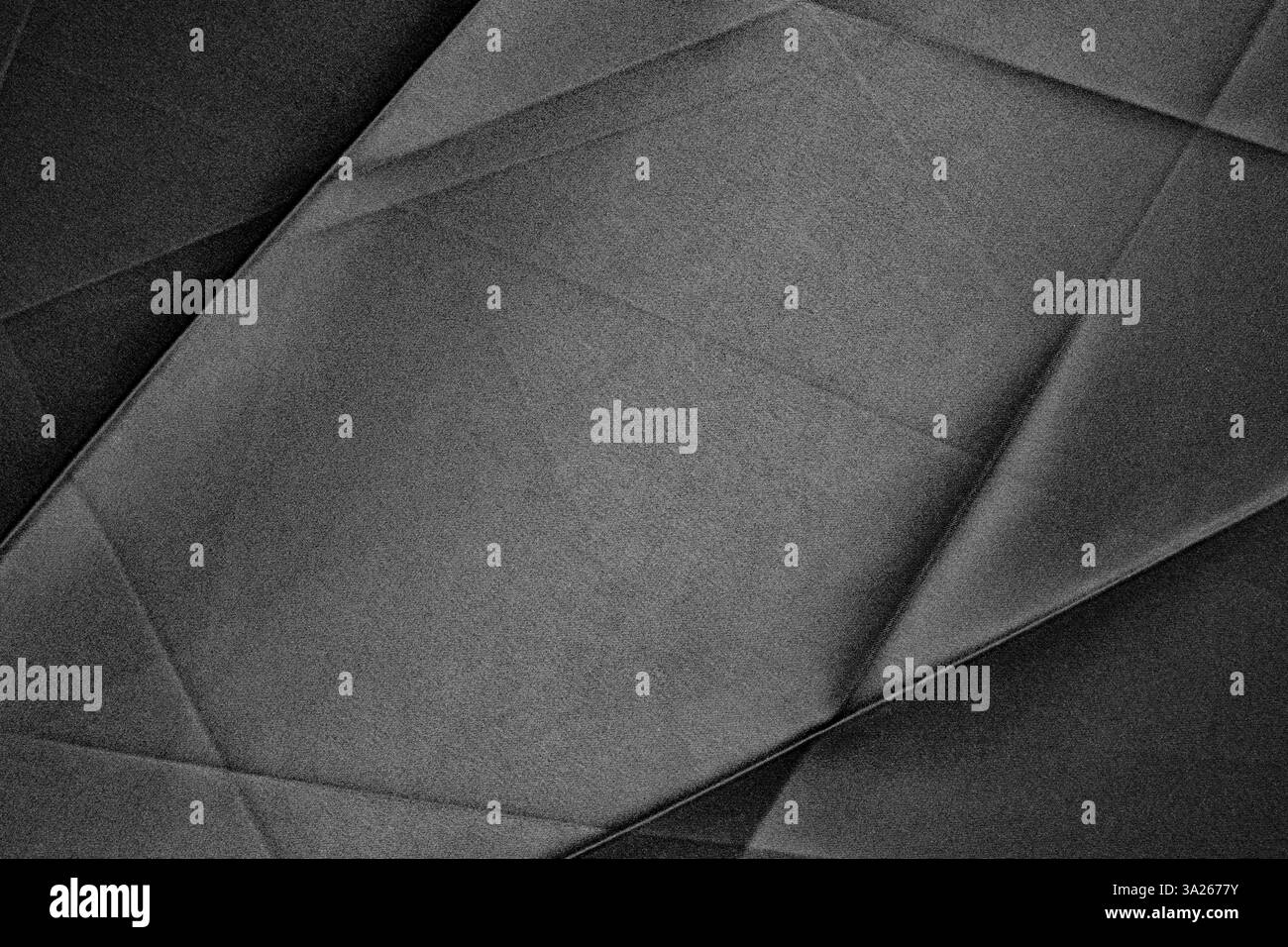 Black fabric texture featuring dynamic lines and deep shadows enhances ...